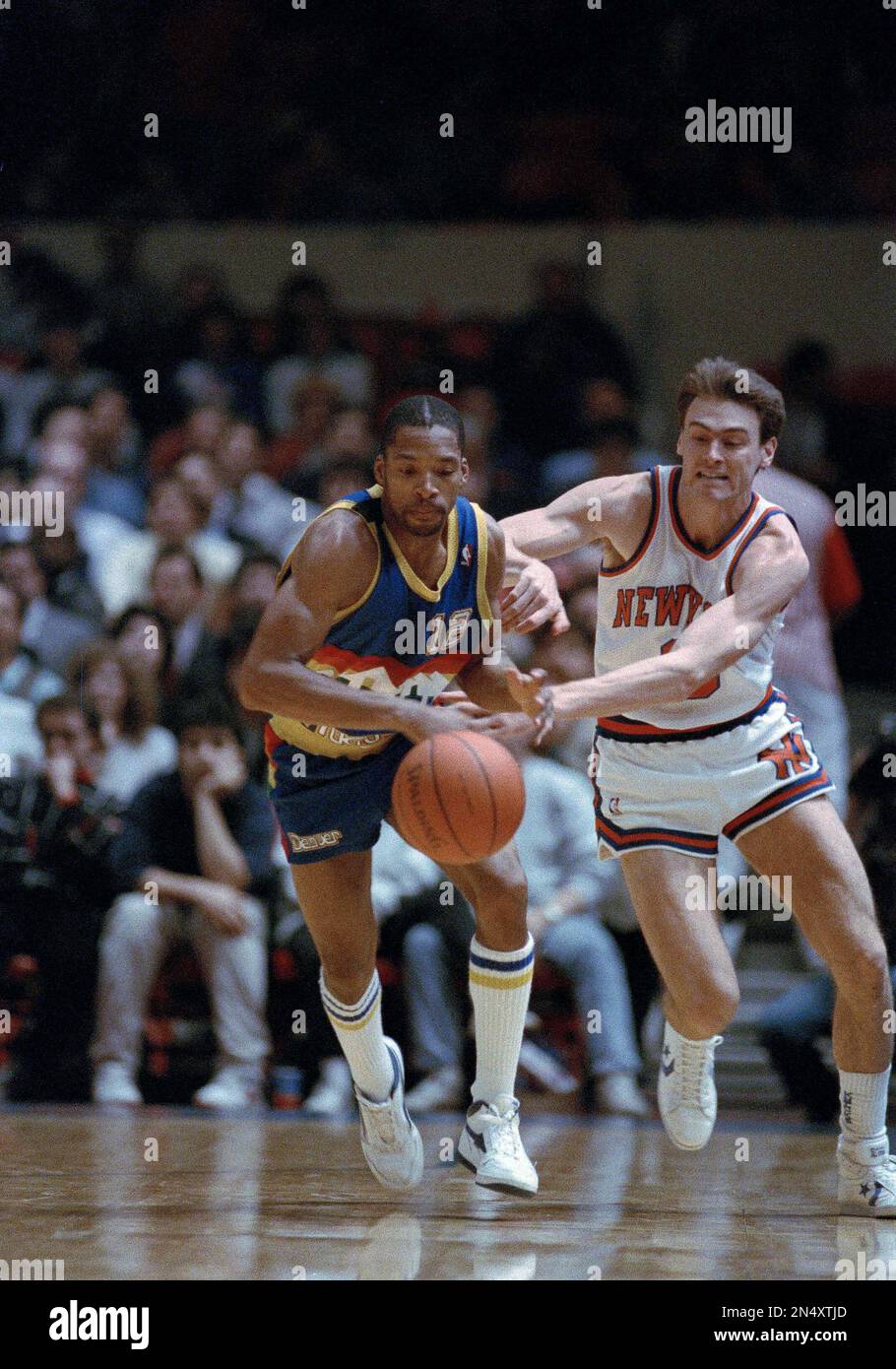 Lafayette Lever (12) of the Denver Nuggets and Rick Carlisle of the New ...