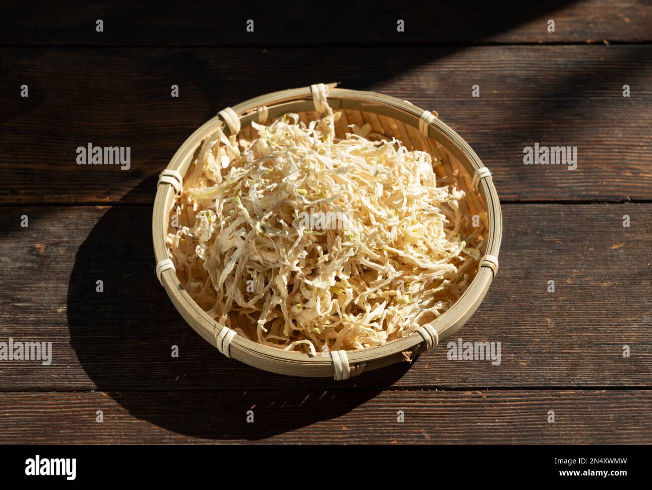 Kiriboshi-daikon (dried daikon) placed against a background of trees in ...