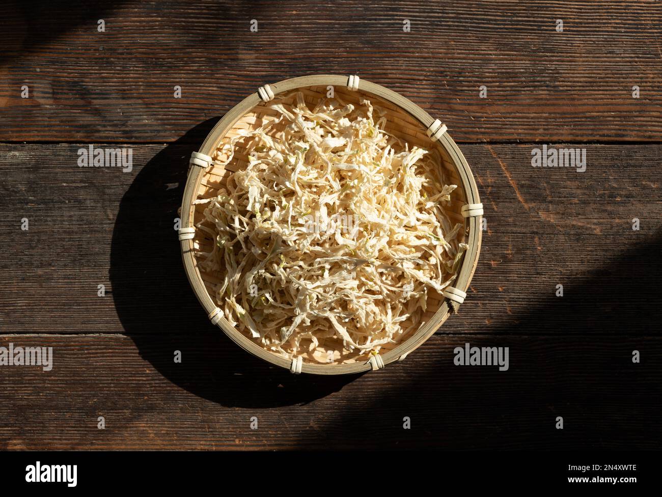 Kiriboshi-daikon (dried daikon) placed against a background of trees in ...
