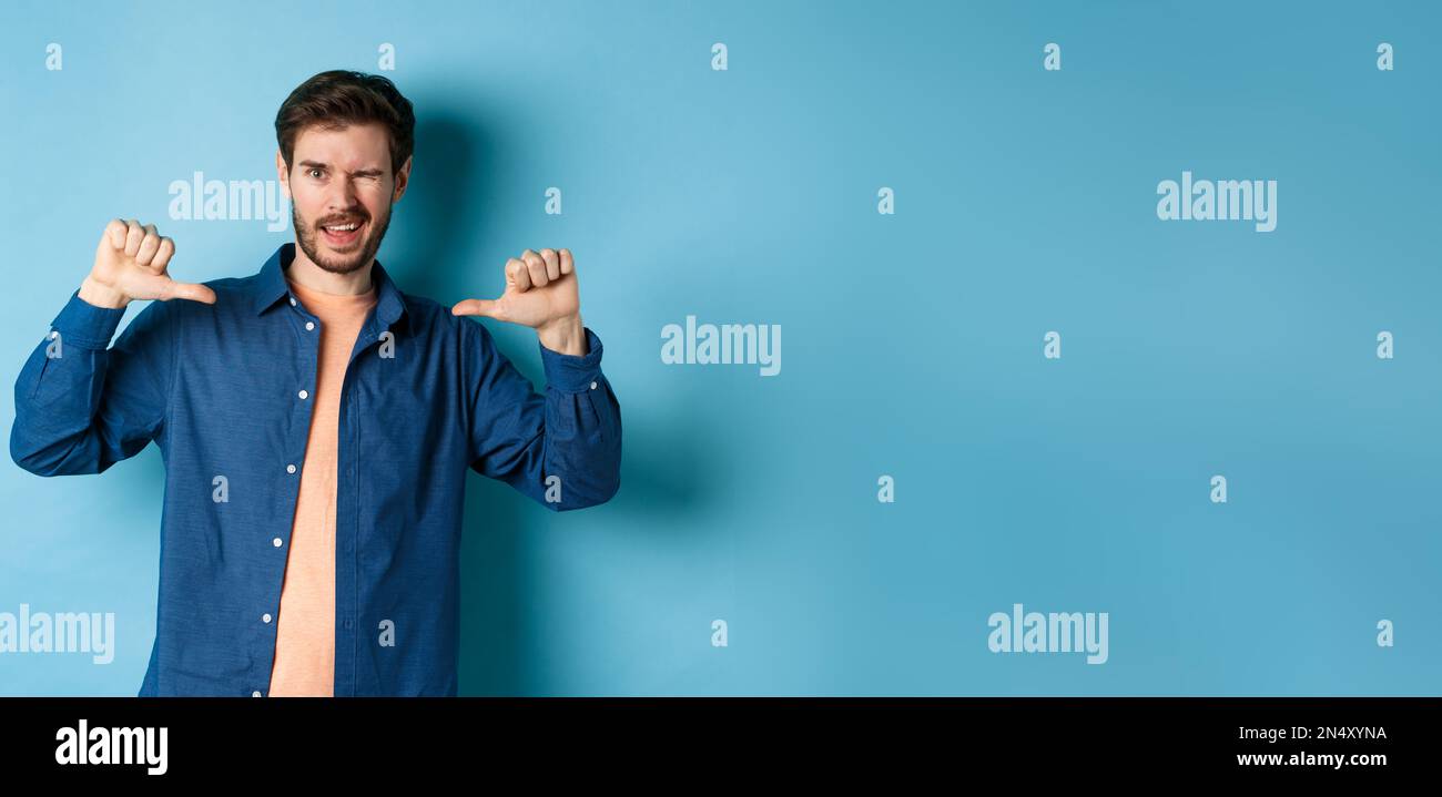 Mature winking man pointing hi-res stock photography and images - Alamy