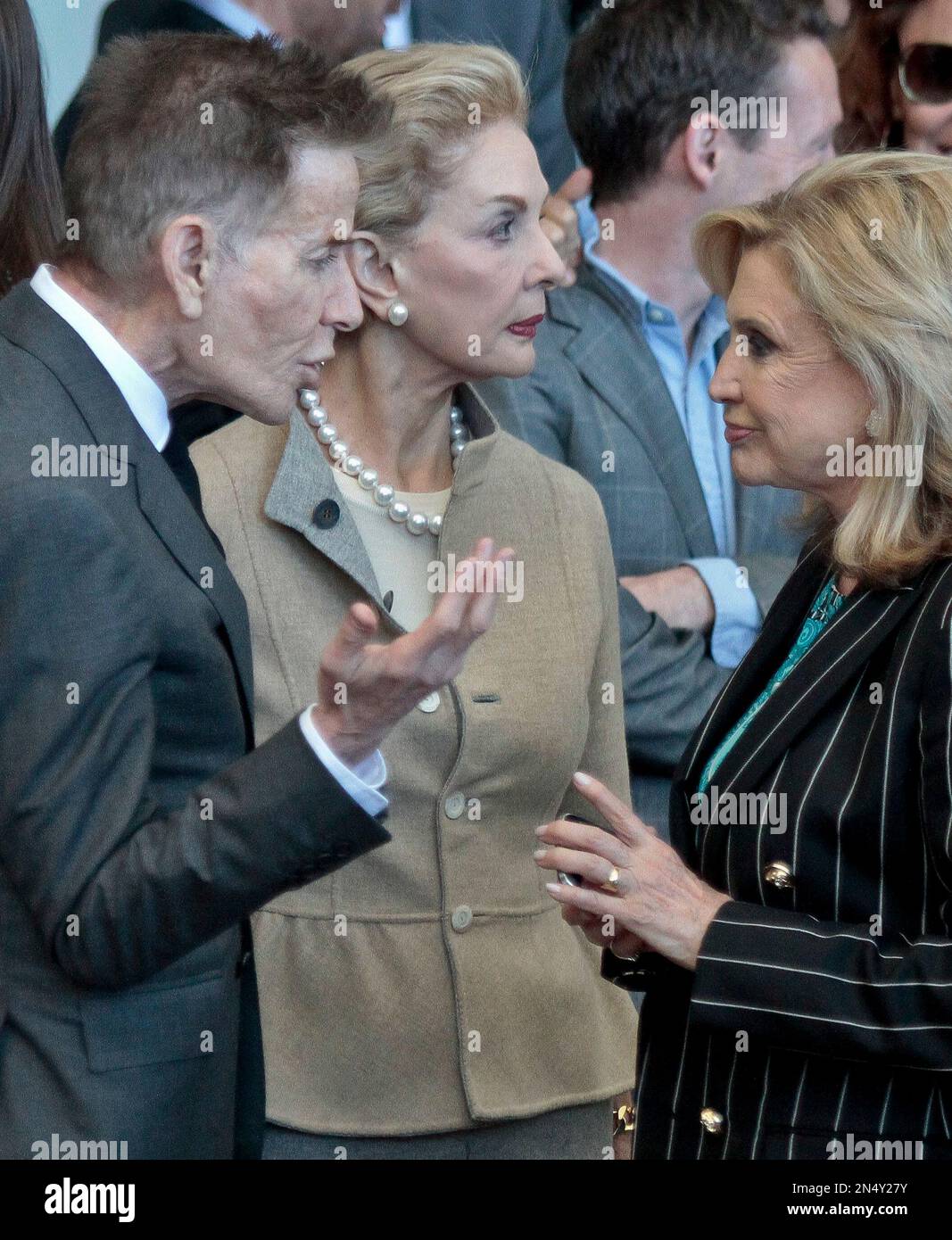 Fashion designers Calvin Klein, left, and Carolina Herrera, center ...
