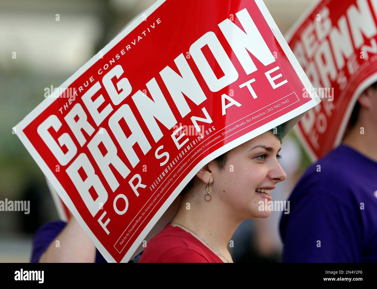 Savannah Tedesco, of Waynesville, N.C., wears a campaign sign for North ...