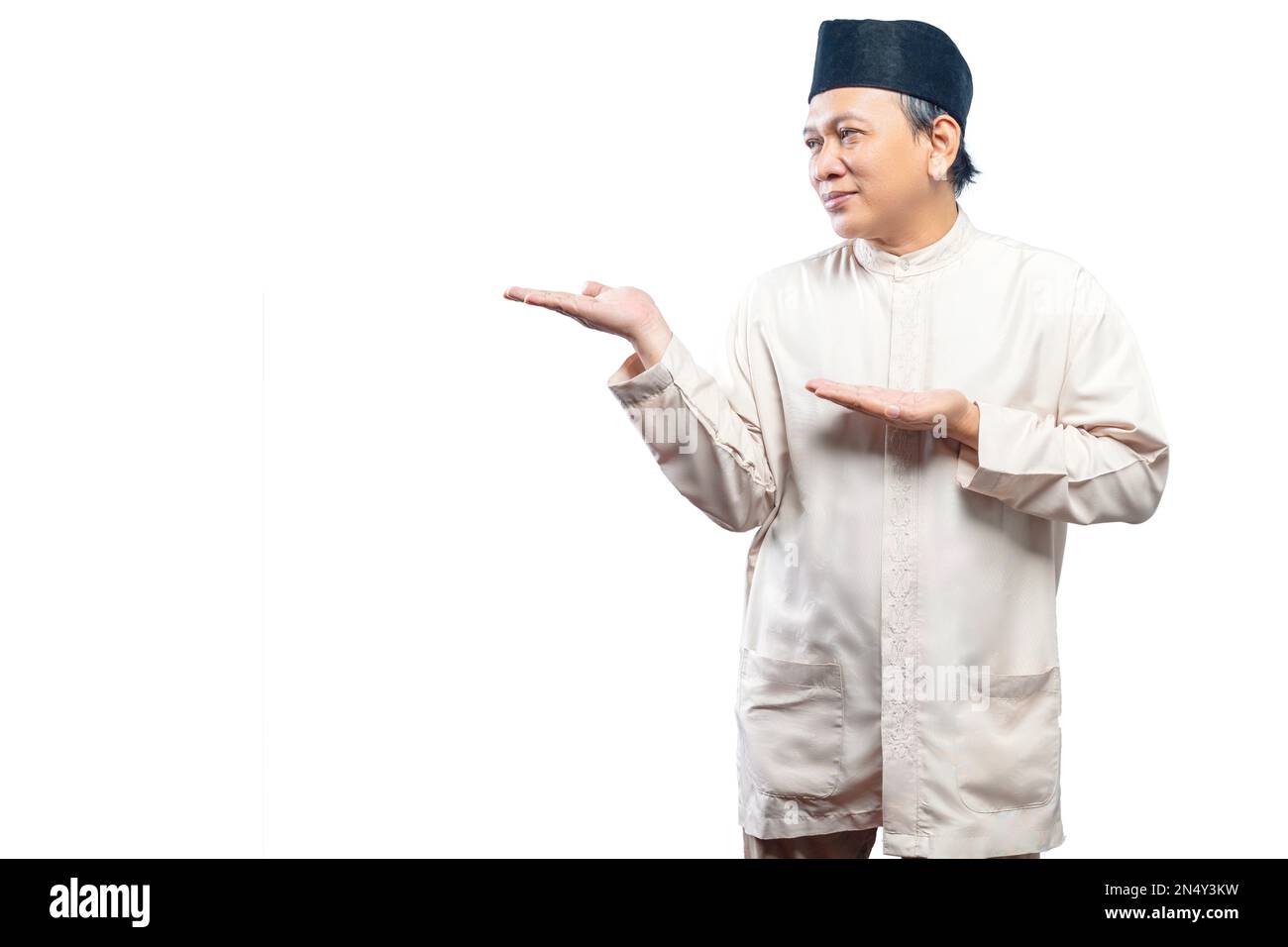 Asian Muslim man with open palm hand showing something isolated over ...