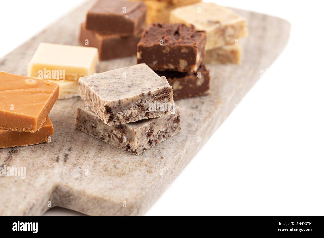 An Assortment of Various Flavors of Fudge on a White Background Stock ...