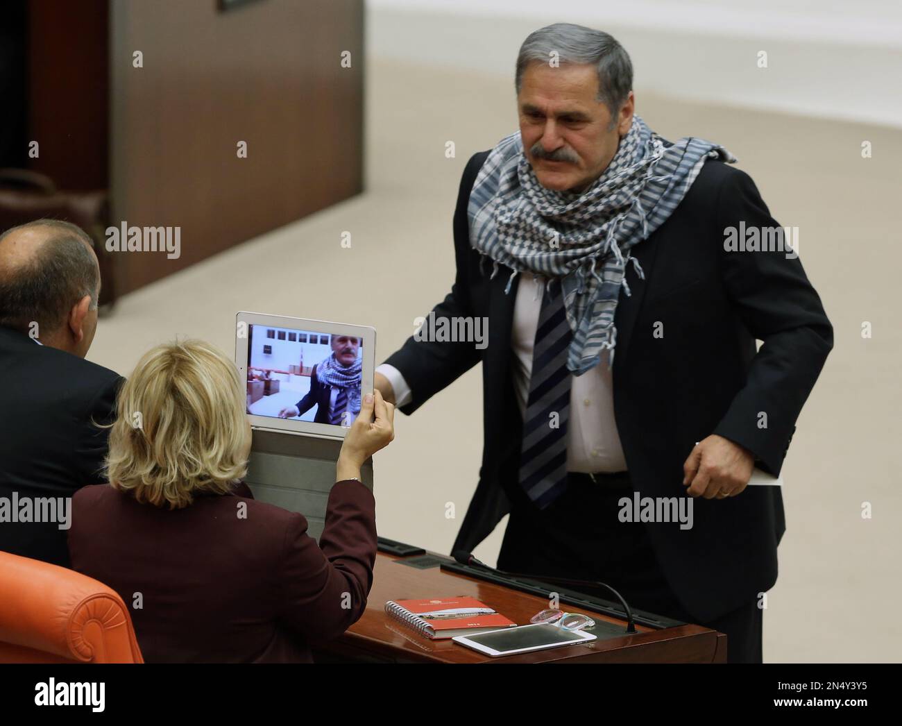 Opposition Republican People's Party, CHP, lawmaker Melda Onur uses her tablet for a live ...