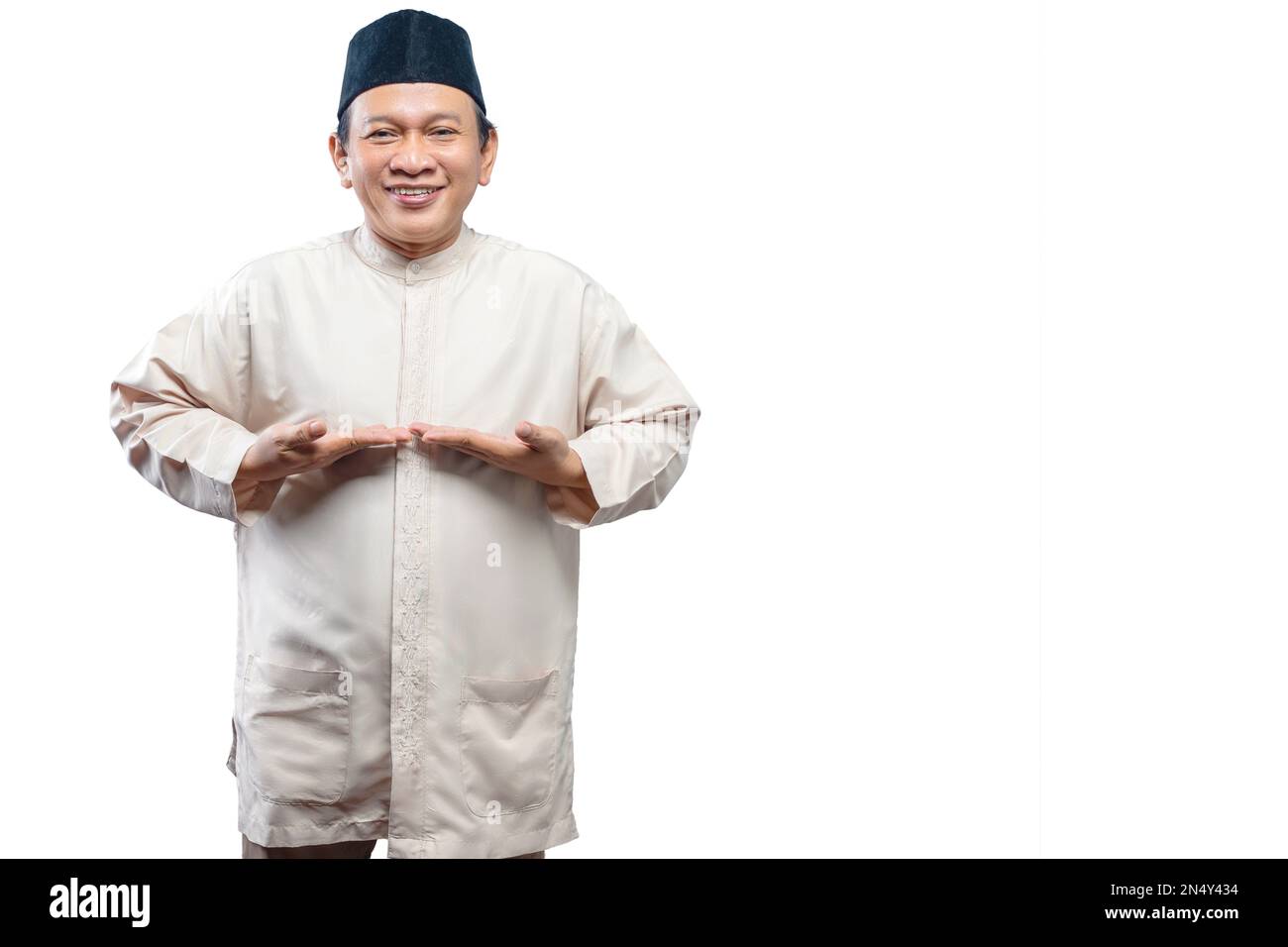 Asian Muslim man with open palm hand showing something isolated over ...
