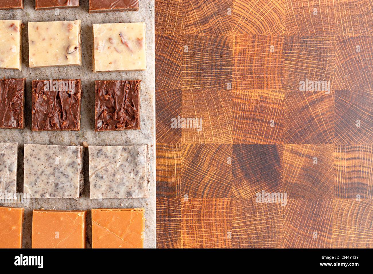 Assortment of Various Flavors of Fudge on a Wooden Butcher Block Stock ...