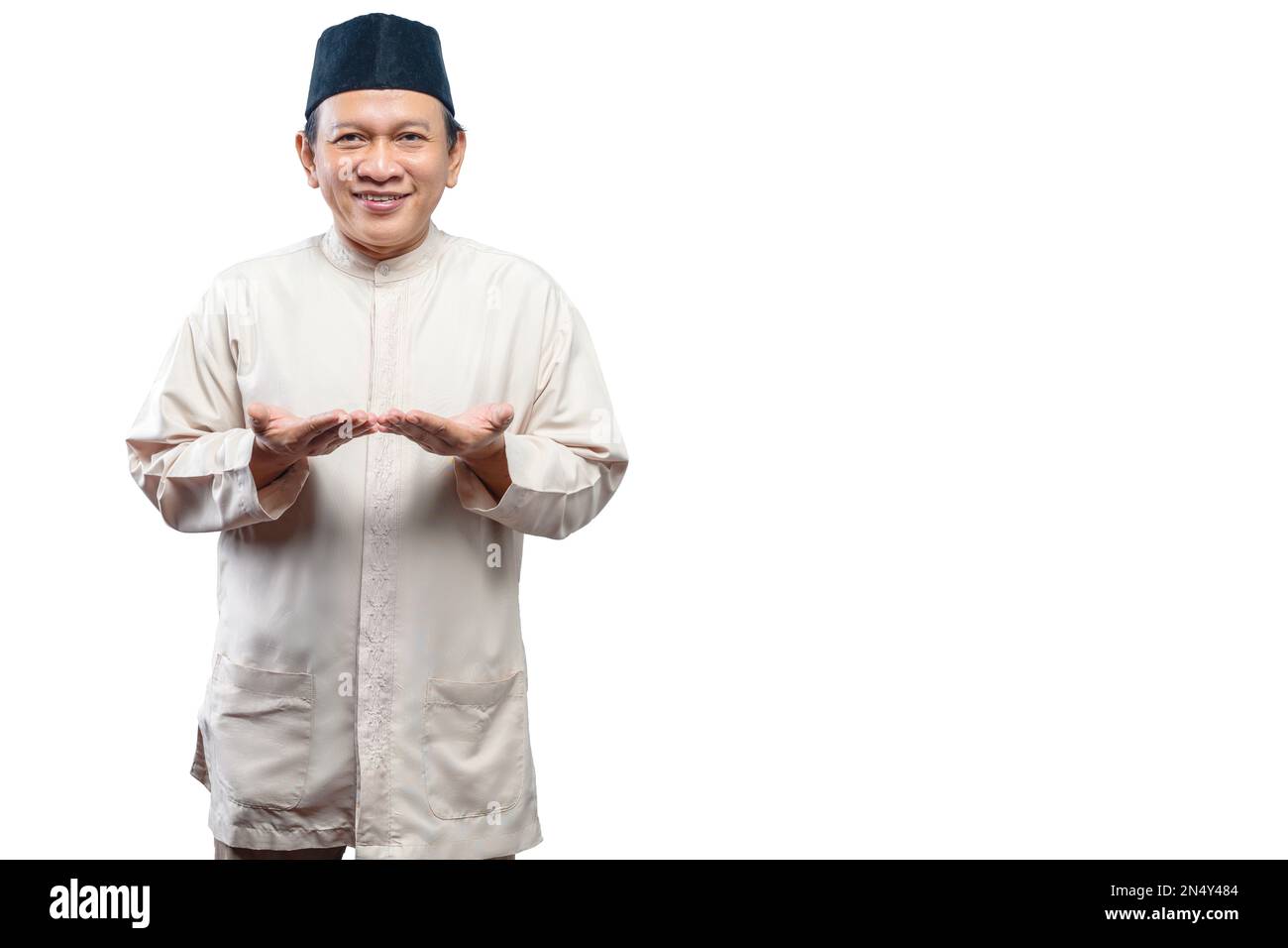 Asian Muslim man with open palm hand showing something isolated over ...
