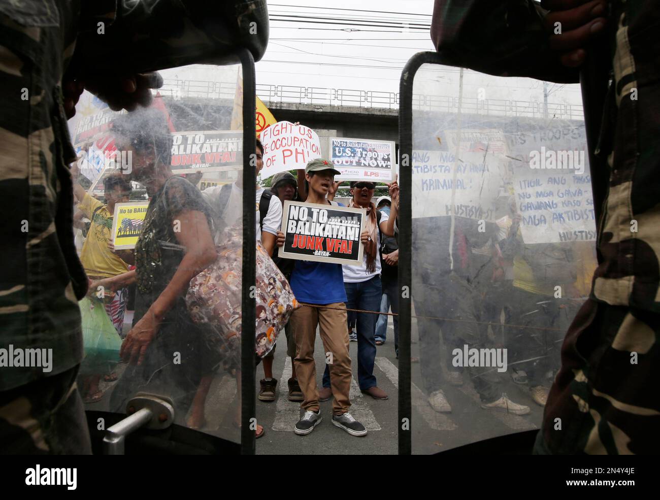 Protesters shout slogans as they picket the headquarters of the Armed ...