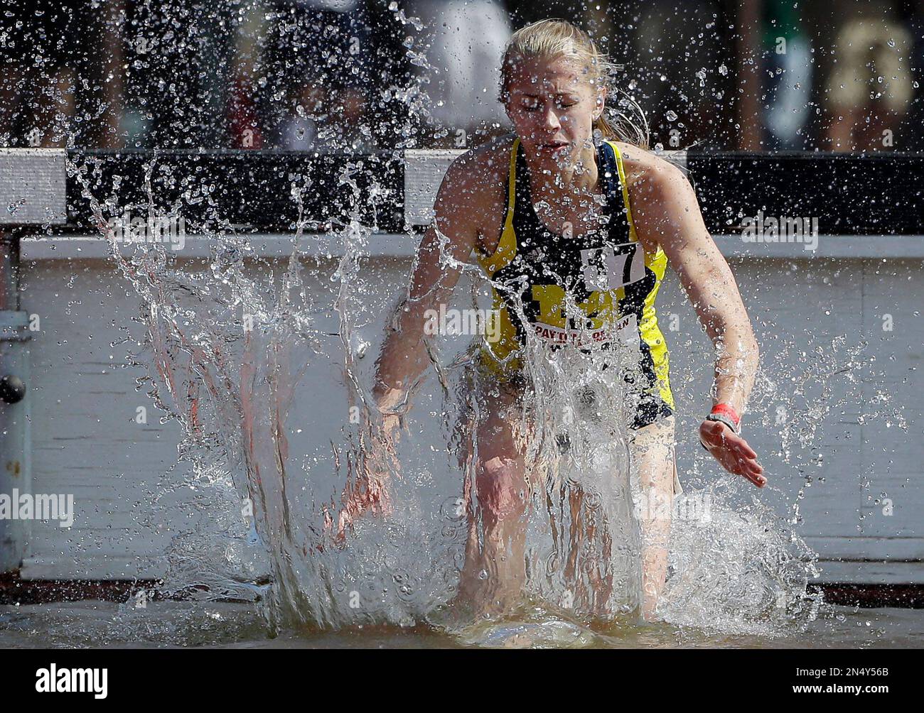 Michigan's Anna Pasternak splashes water as she competes in the 3,000m ...