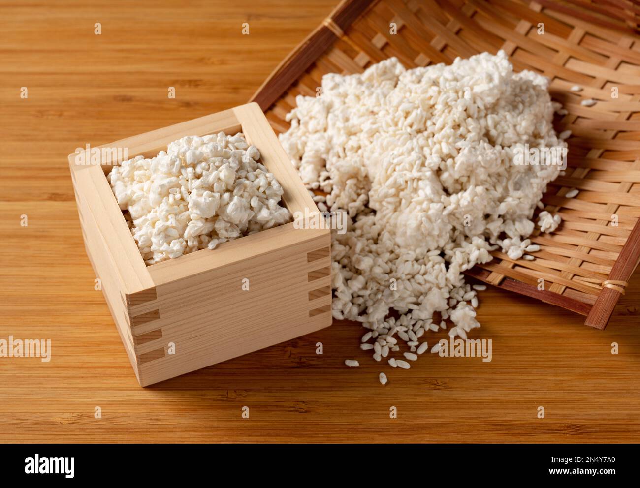 Rice koji in a colander and Masu on the table. Koji. Koji is fermented ...