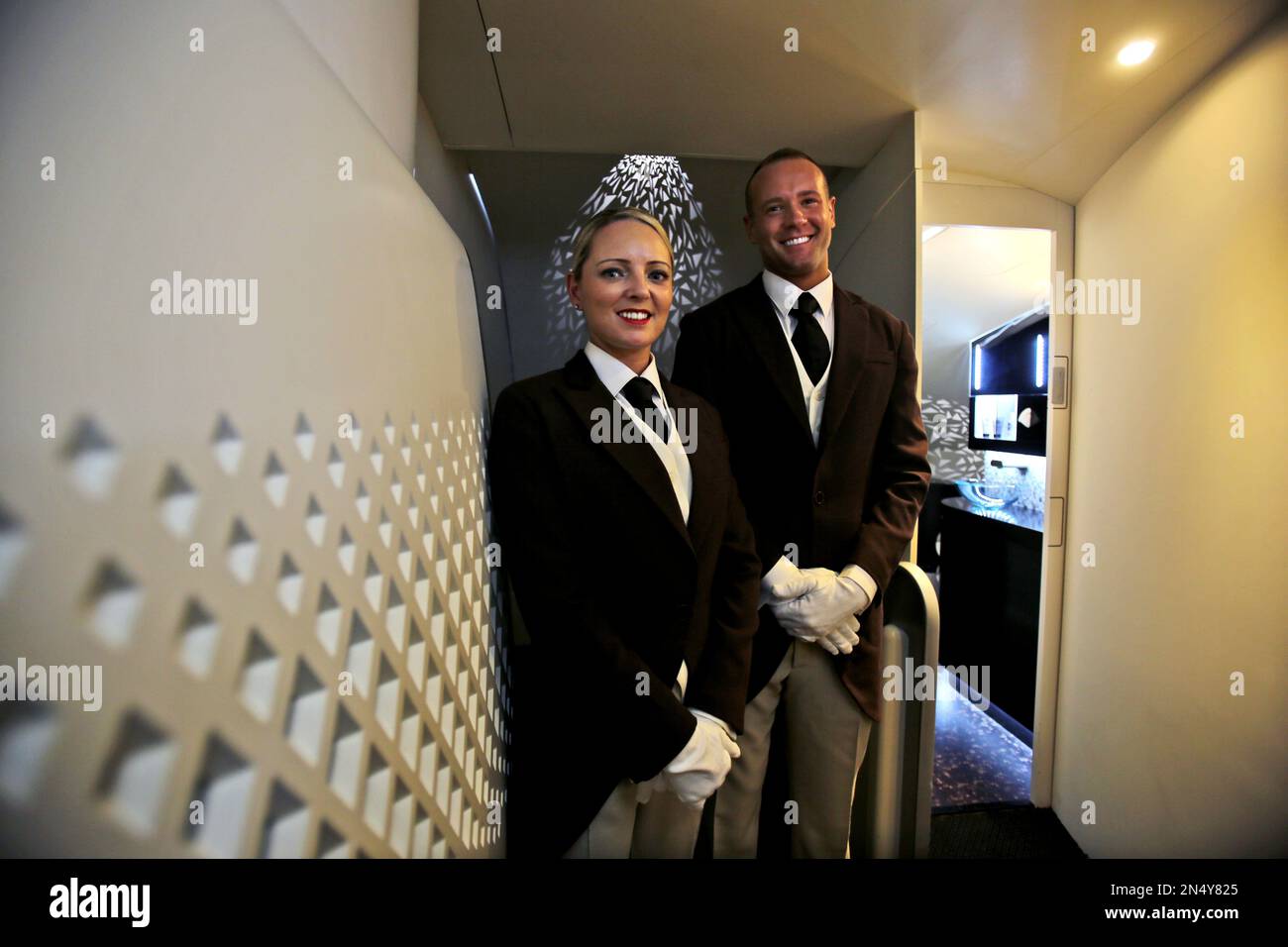 Etihad Airways butlers pose for a photograph, at a training facility in ...