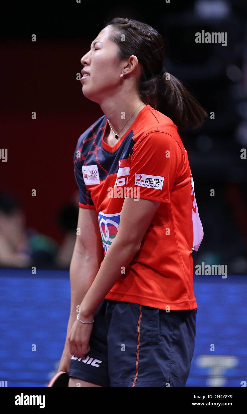 Yu Mengyu of Singapore reacts after loosing a point during her ...