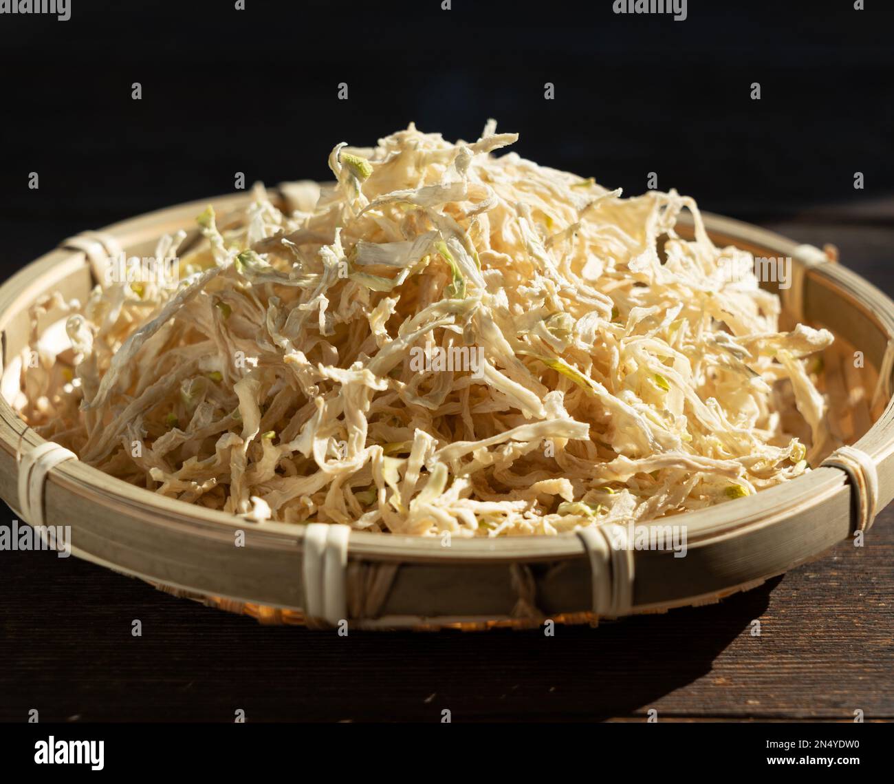Kiriboshi-daikon (dried daikon) placed against a background of trees in ...