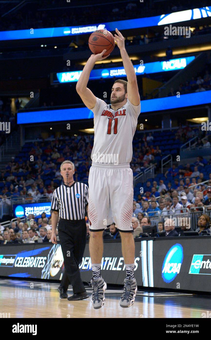 Louisville forward Luke Hancock (11) goes up for a shot during a third ...
