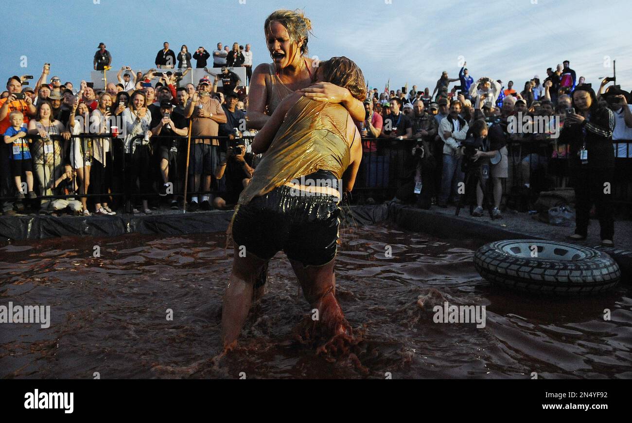 Participants wrestle in barbecue sauce at Talladega Superspeedway ...