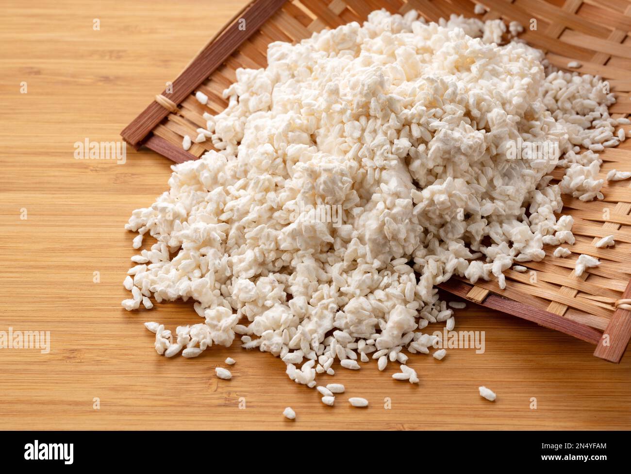 Rice koji in a colander on the table. Koji. Koji is fermented rice ... Rice koji in a colander on the table. Koji. Koji is fermented rice ...