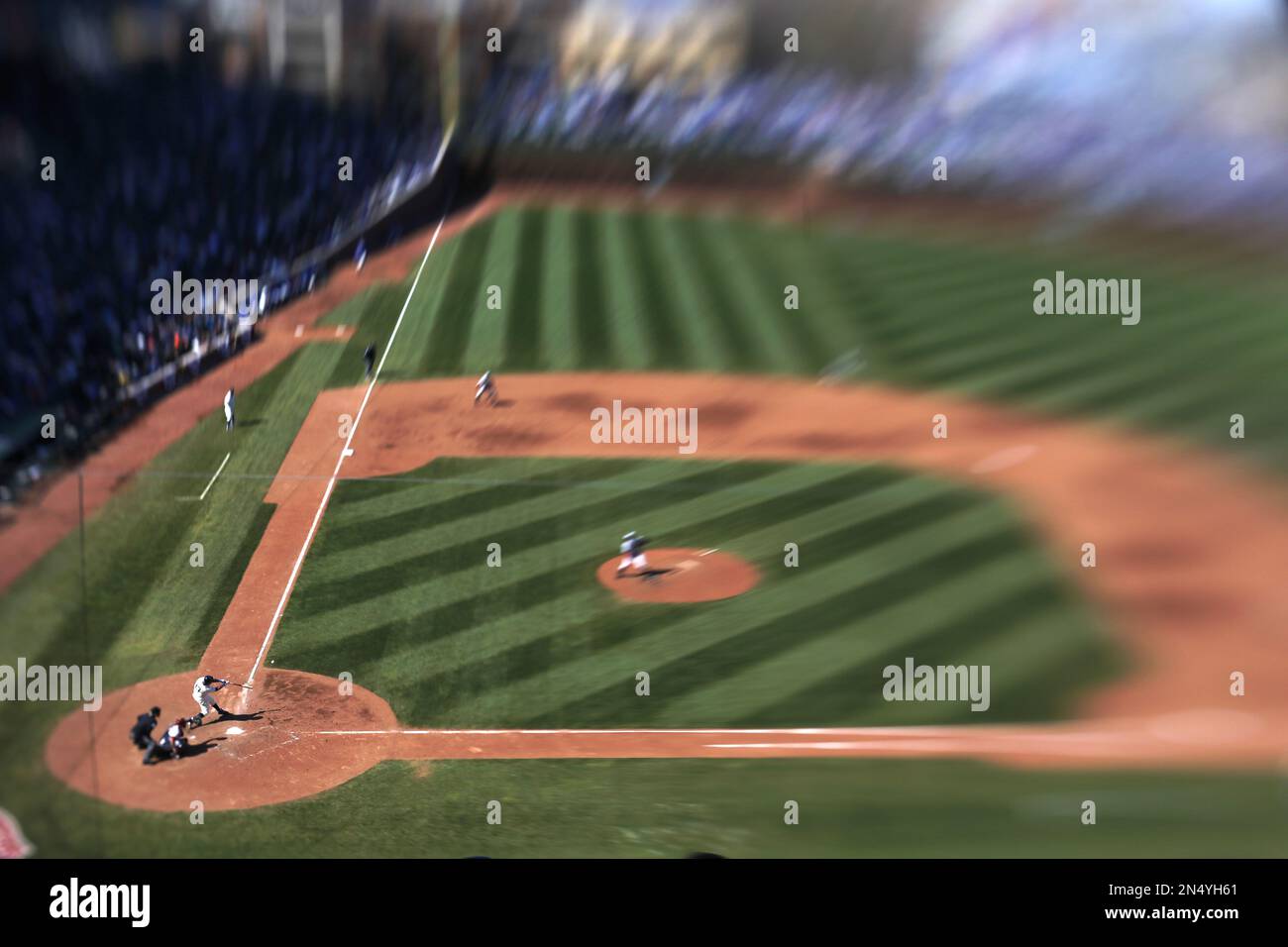 Pictured using a Lensbaby is a batter at home plate in Wrigley Field at ...