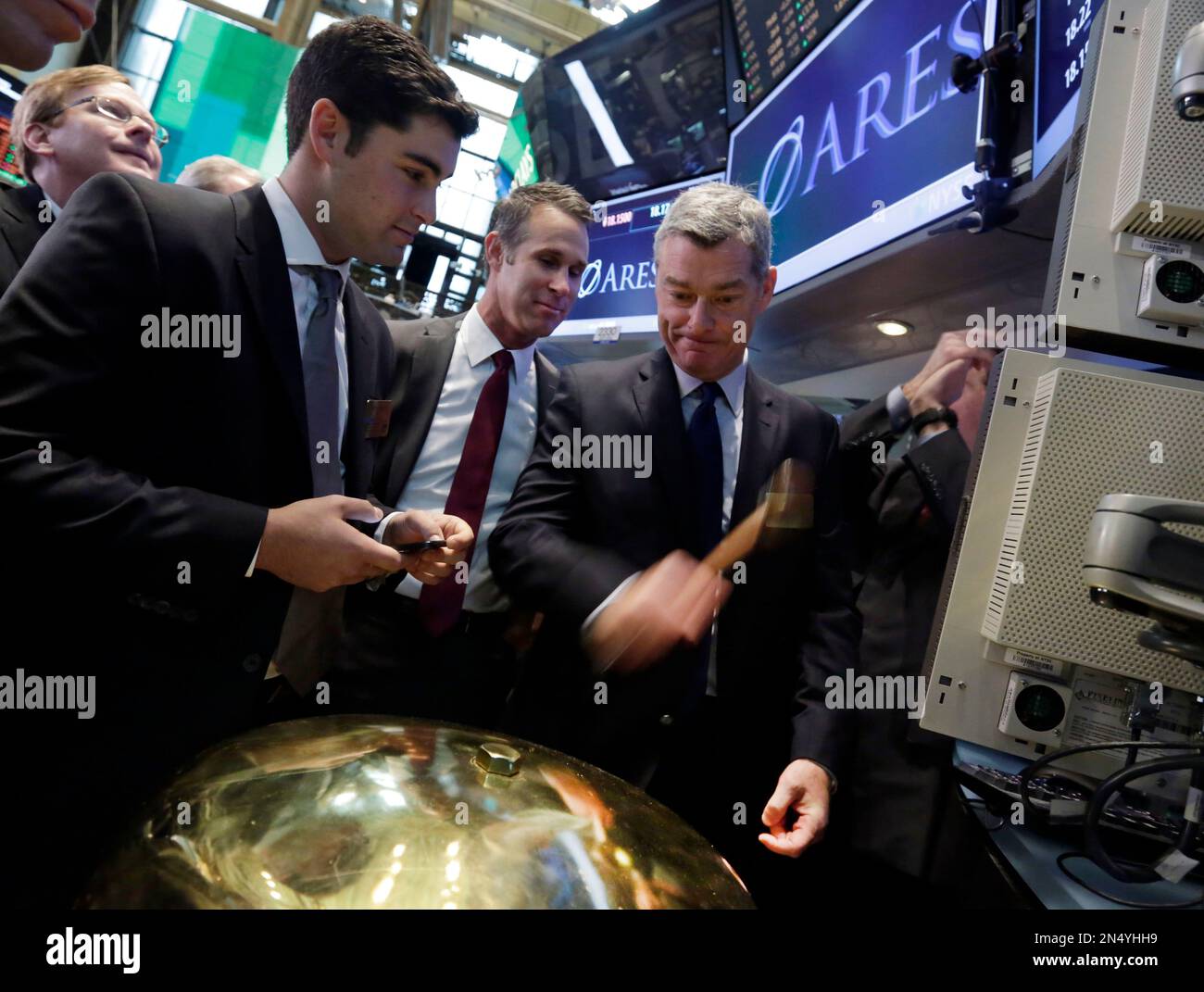 Ares Management CEO Tony Ressler, right, accompanied by his son Oliver ...