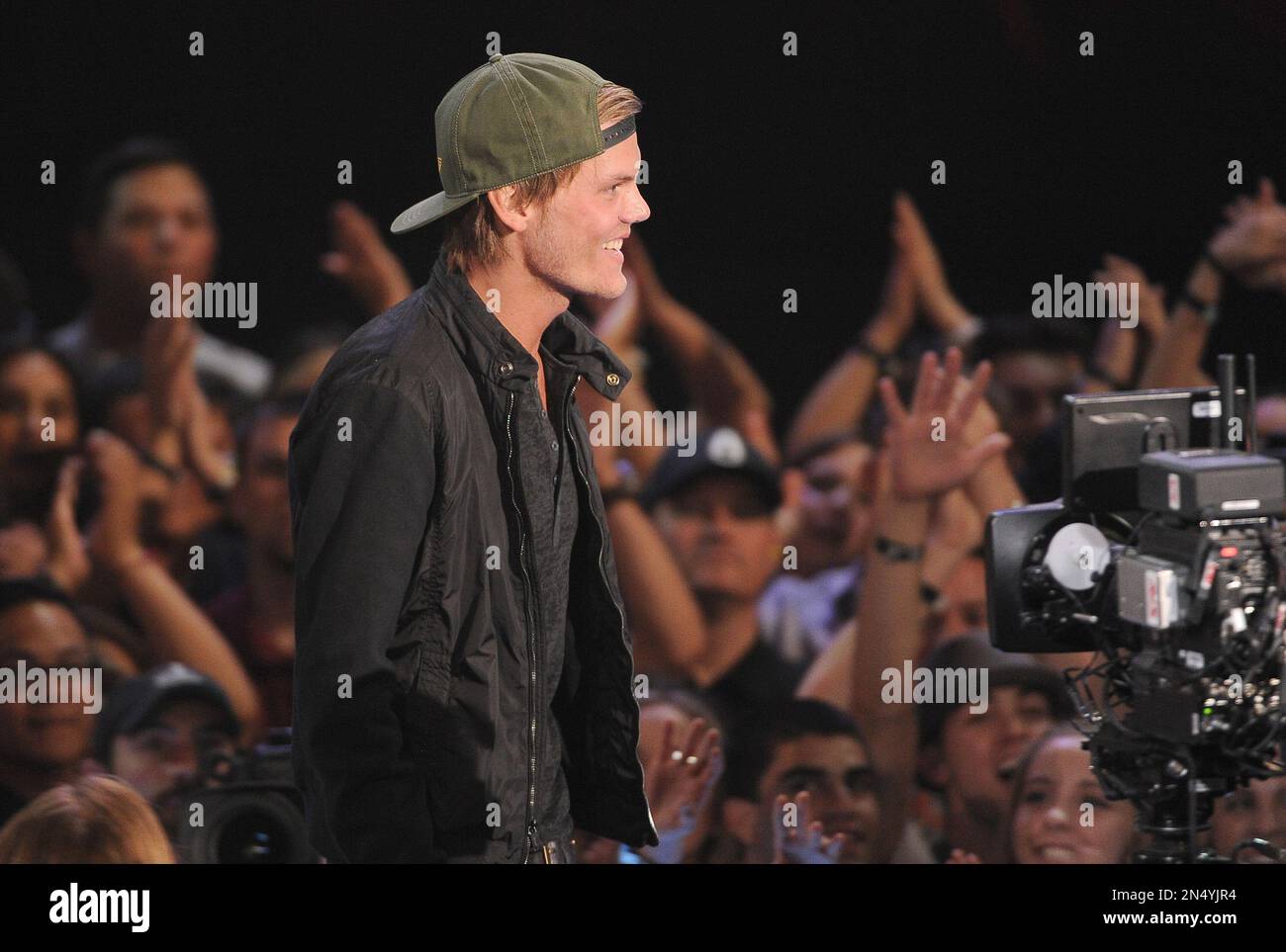 Avicii accepts the award for EDM song of the year at the iHeartRadio ...