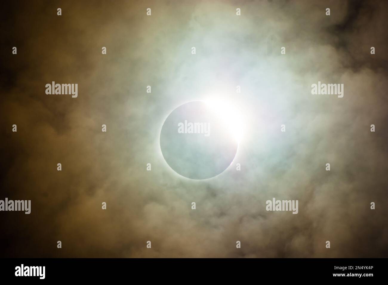 Solar eclipse behind clouds Stock Photo - Alamy