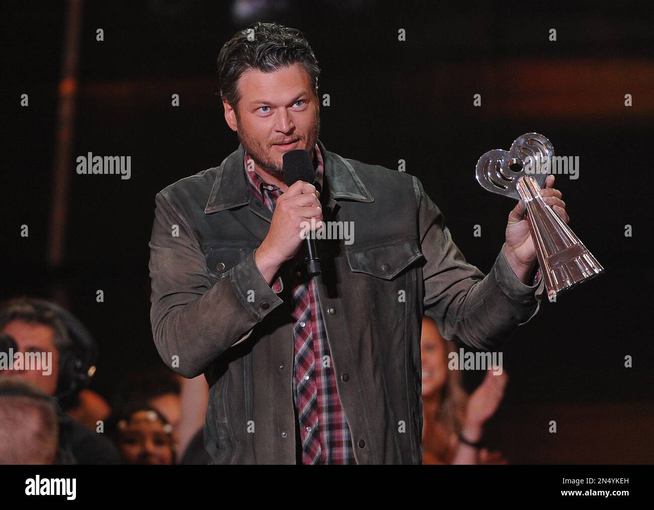 Blake Shelton accepts the award for country song of the year for "Boys ...