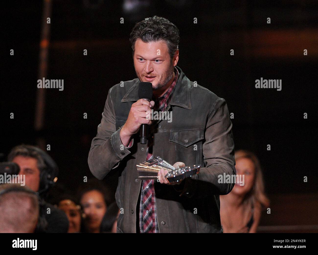 Blake Shelton accepts the award for country song of the year for "Boys ...