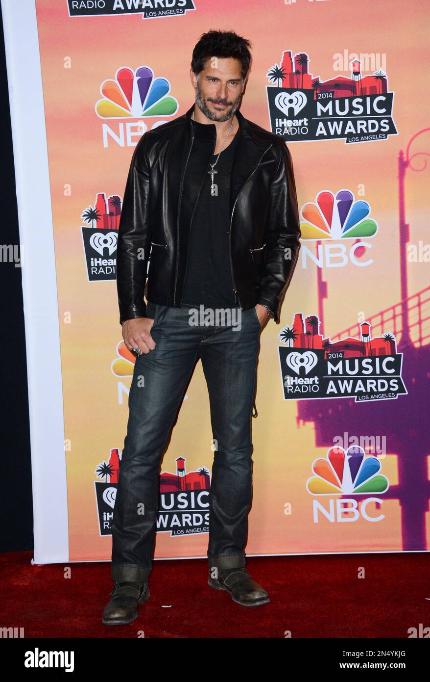 Joe Manganiello poses in the press room at the iHeartRadio Music Awards ...