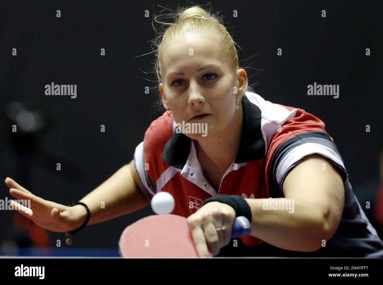 Barbora Balazova of Slovakia returns a shot to Ri Myong Sun of North ...