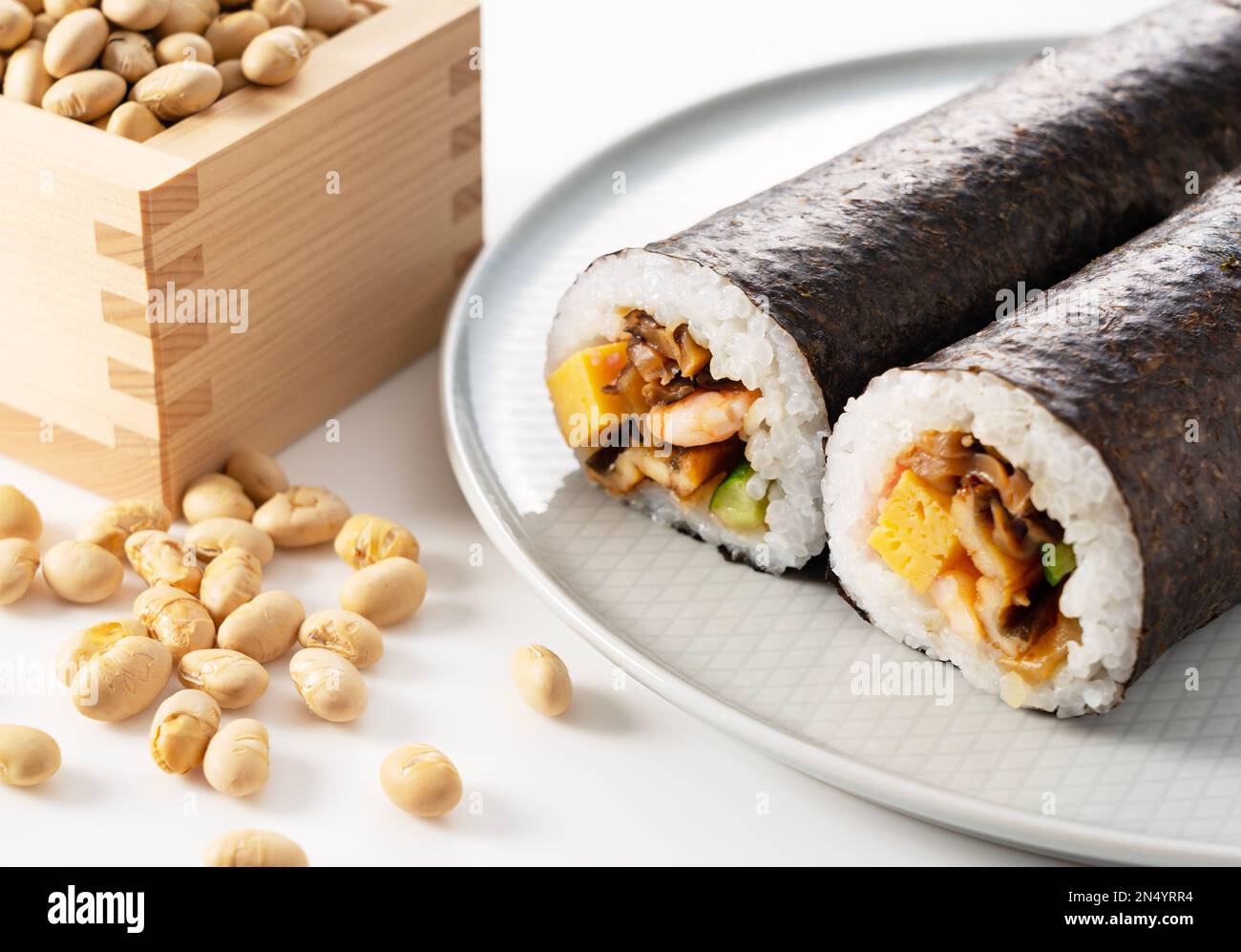 Eho-maki rolls and soybeans for bean-throwing on a white background ...