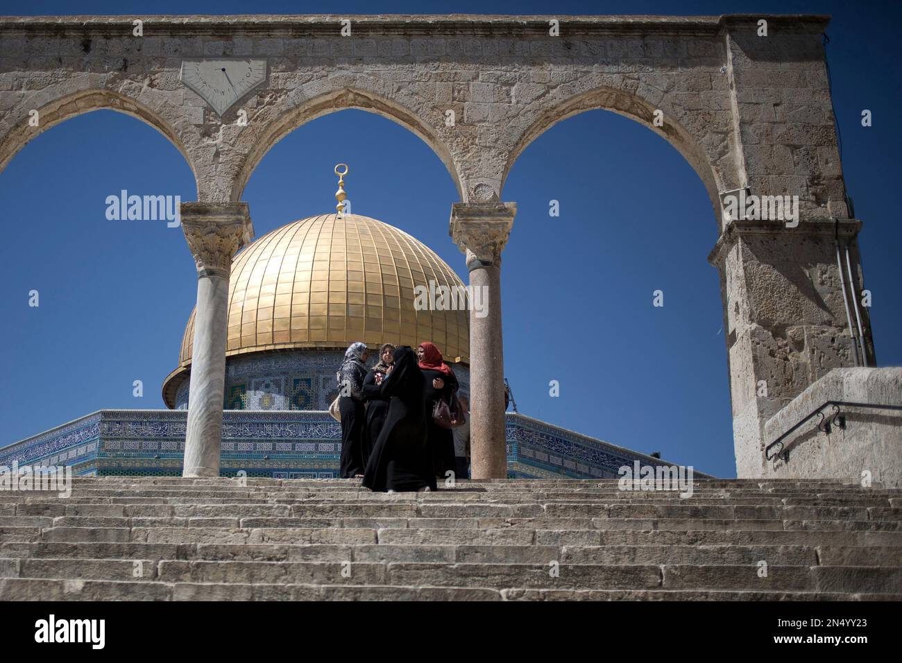 Muslim women gather on the stairs leading to to the Golden Dome of the ...