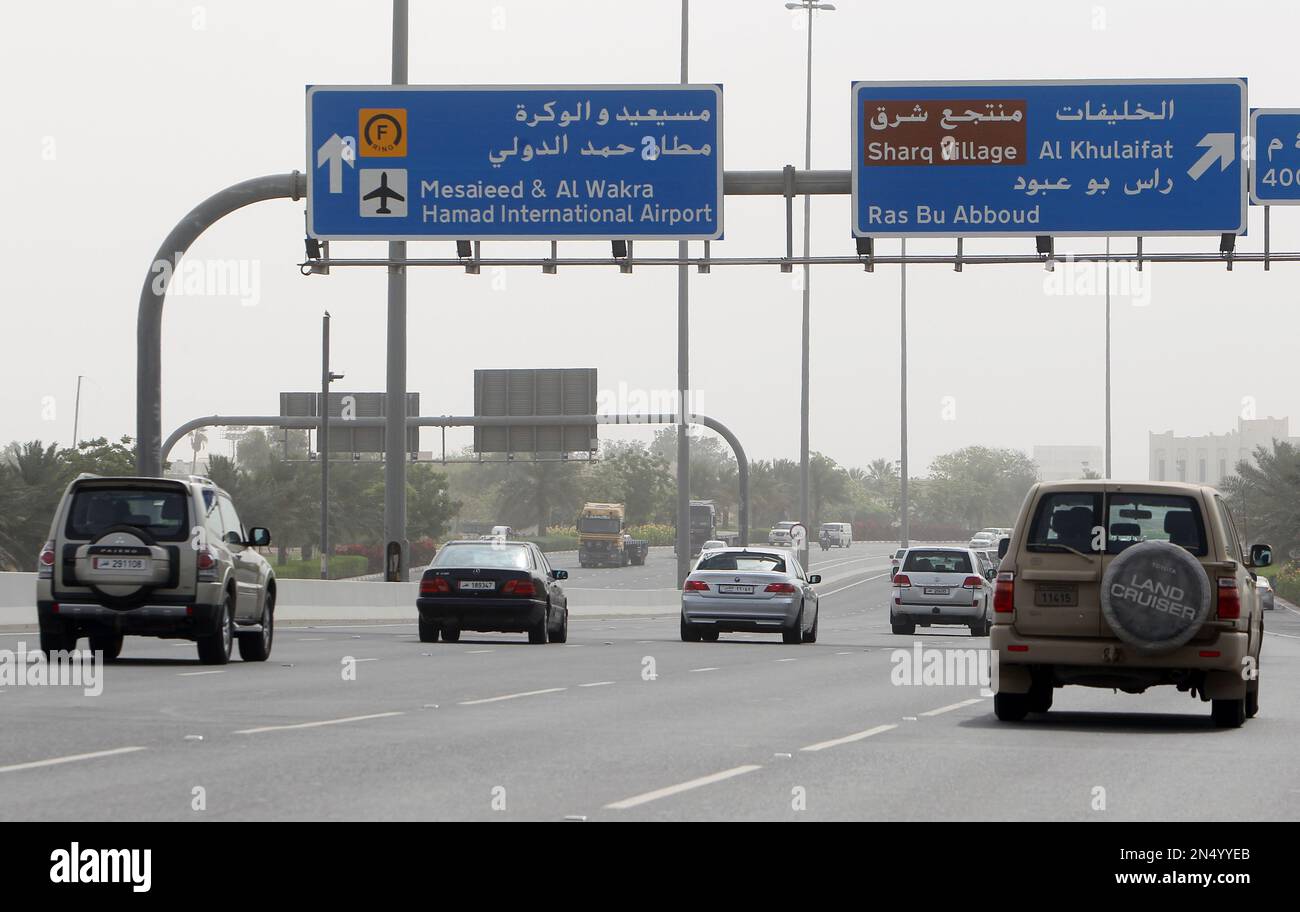 A road sign gives directions to the newly opened Hamad International ...