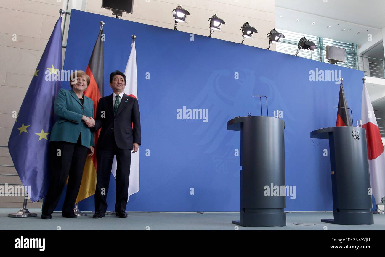 German Chancellor Angela Merkel, left, and Prime Minister of Japan ...