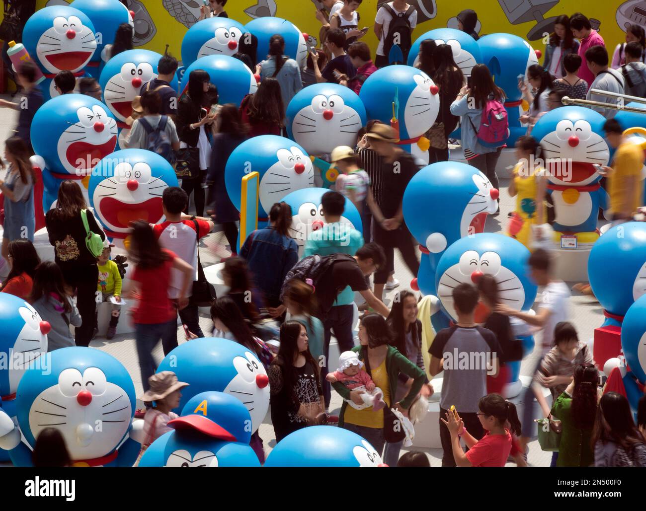 Visitors tour among models of Doraemon, one of Japan's most popular ...