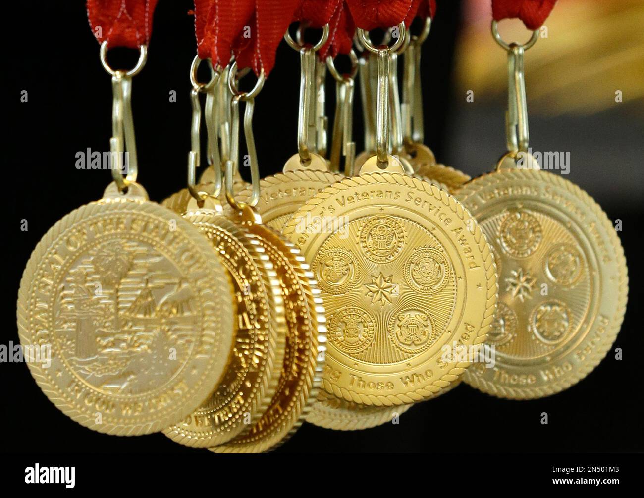 "Governor's Veterans Service Award," medals are shown during a ceremony ...