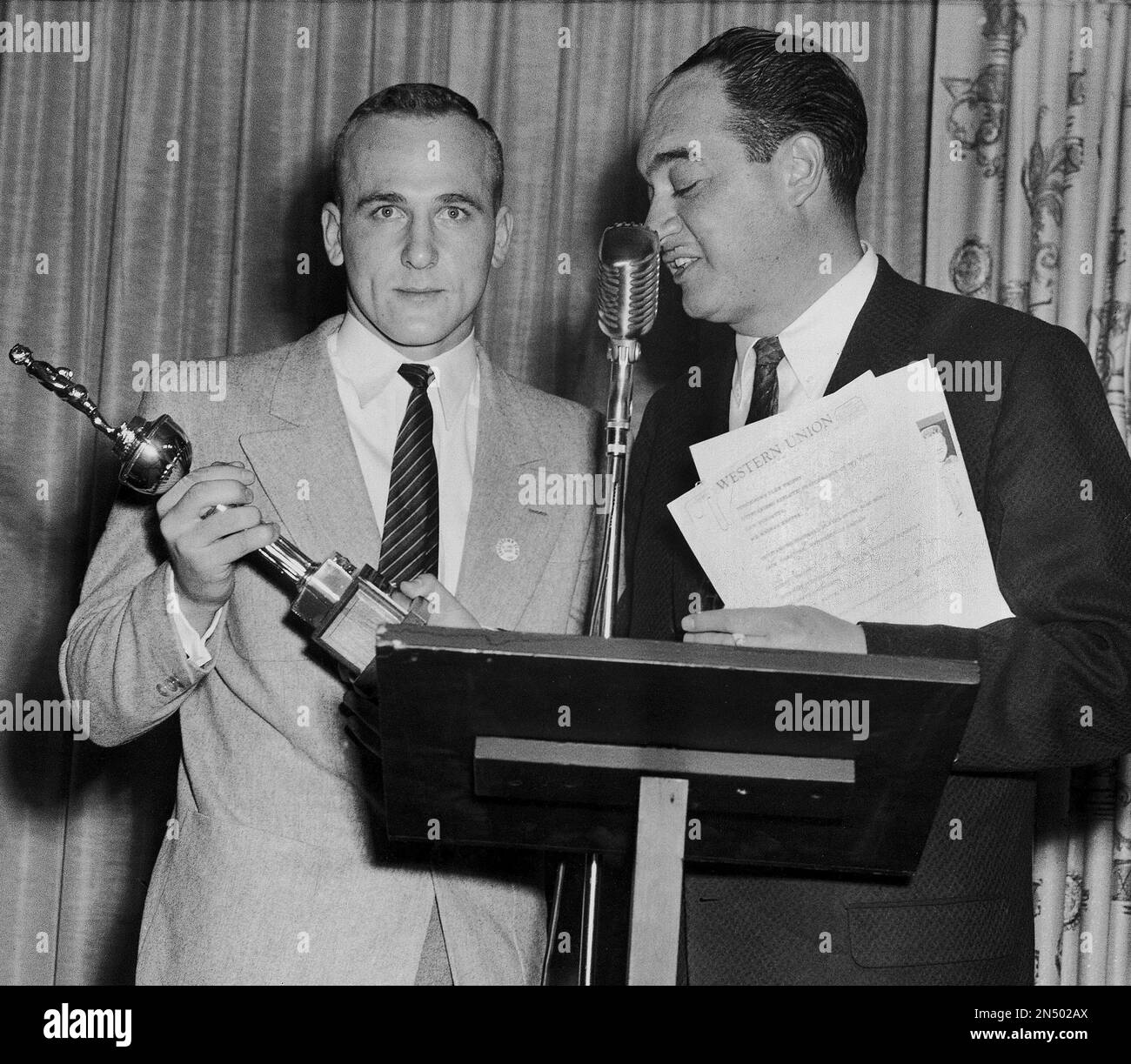 University of Oregon quarterback, Jack Crabtree, left, is honored as ...