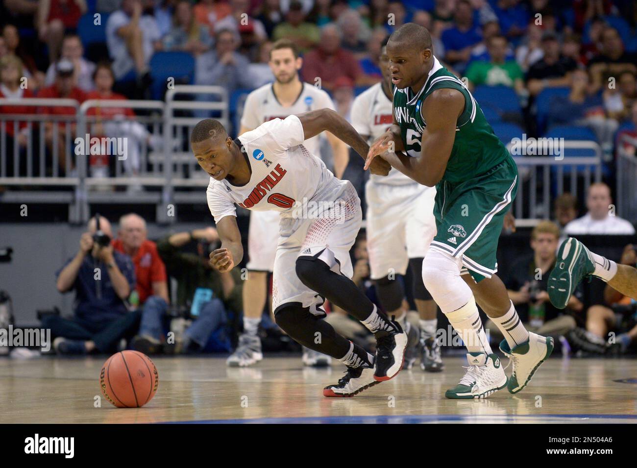 Louisville guard Terry Rozier (0) and Manhattan's Rhamel Brown (5 ...