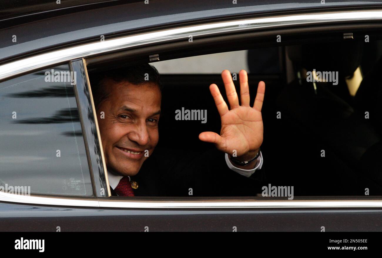 Peru's President Ollanta Humala waves to journalist after a visit to ...