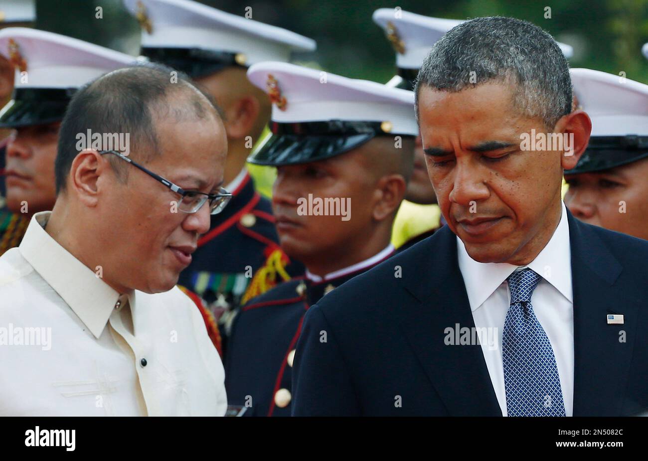 U.S. President Barack Obama, right, reviews the honor guard with ...