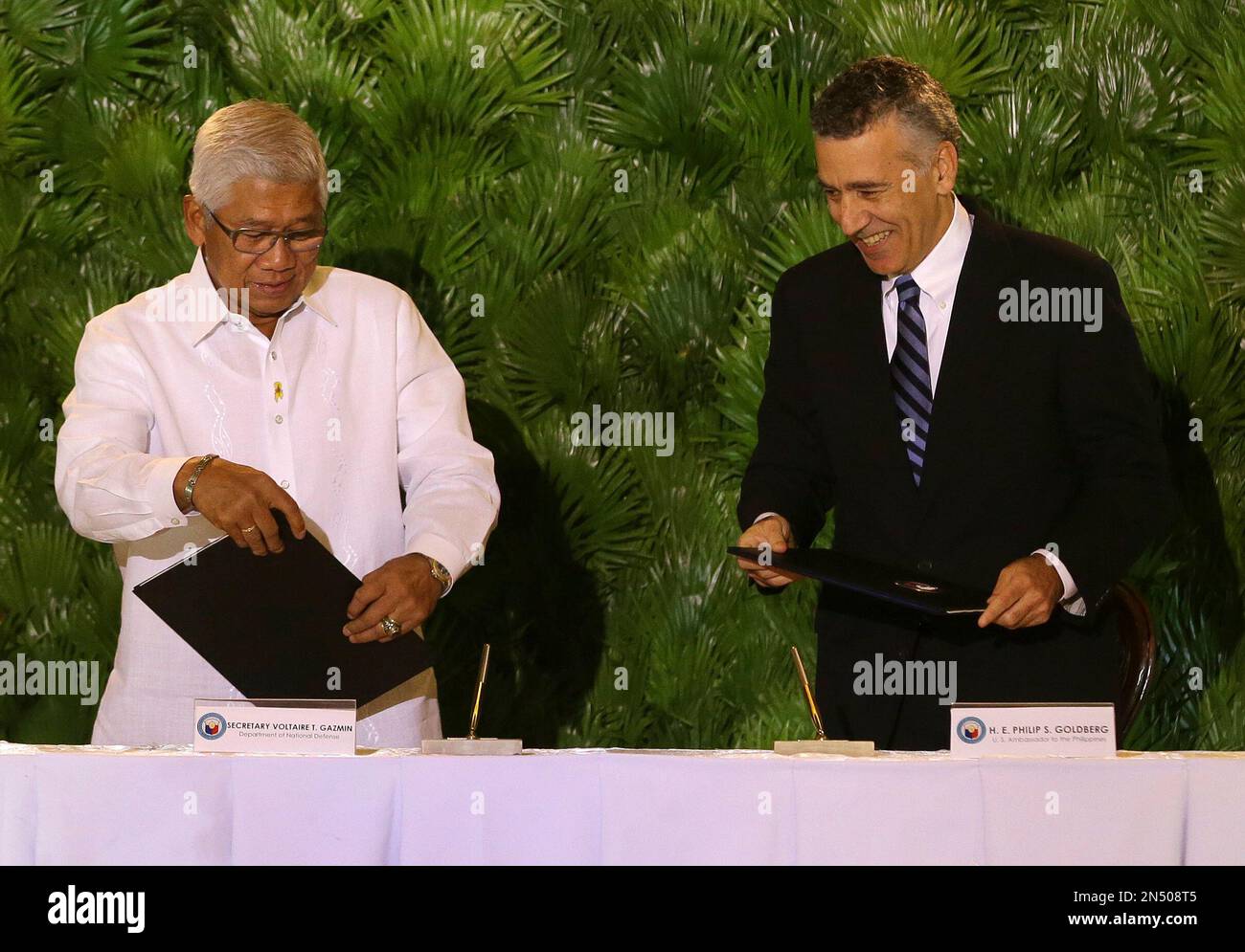 Philippine Defense Secretary Voltaire Gazmin, left, and U.S. Ambassador ...