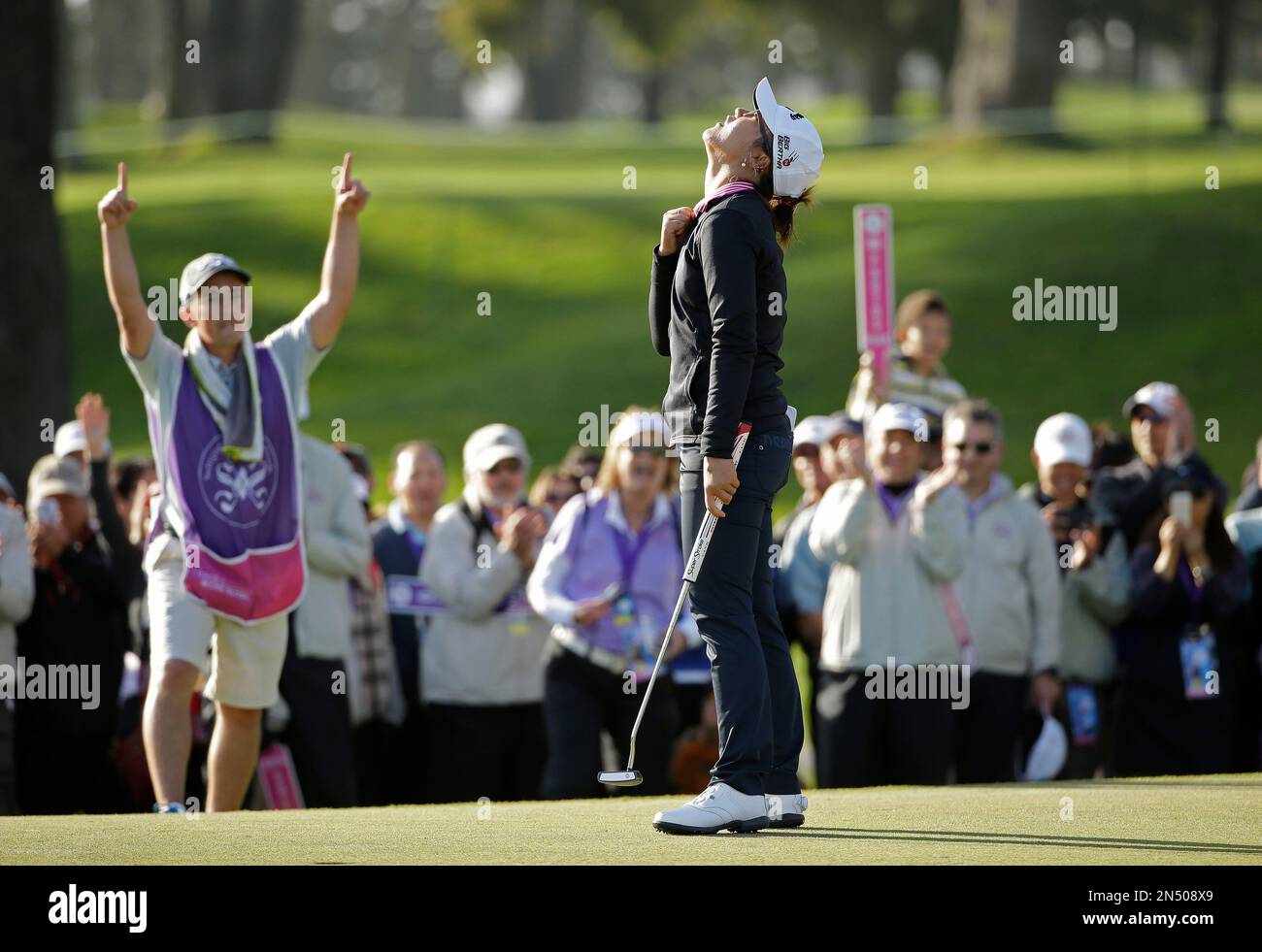 Lydia Ko of New Zealand reacts on the 18th green of the Lake Merced ...