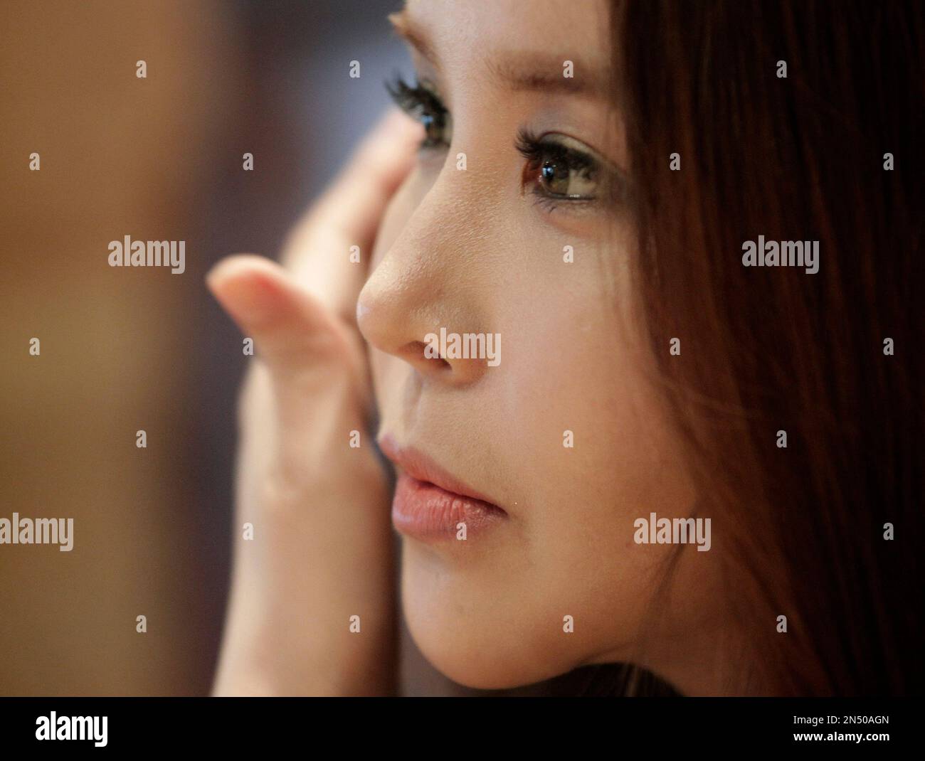 In this March 11, 2014 photo, Harisu, South Korea’s most famous transsexual entertainer, listens ...