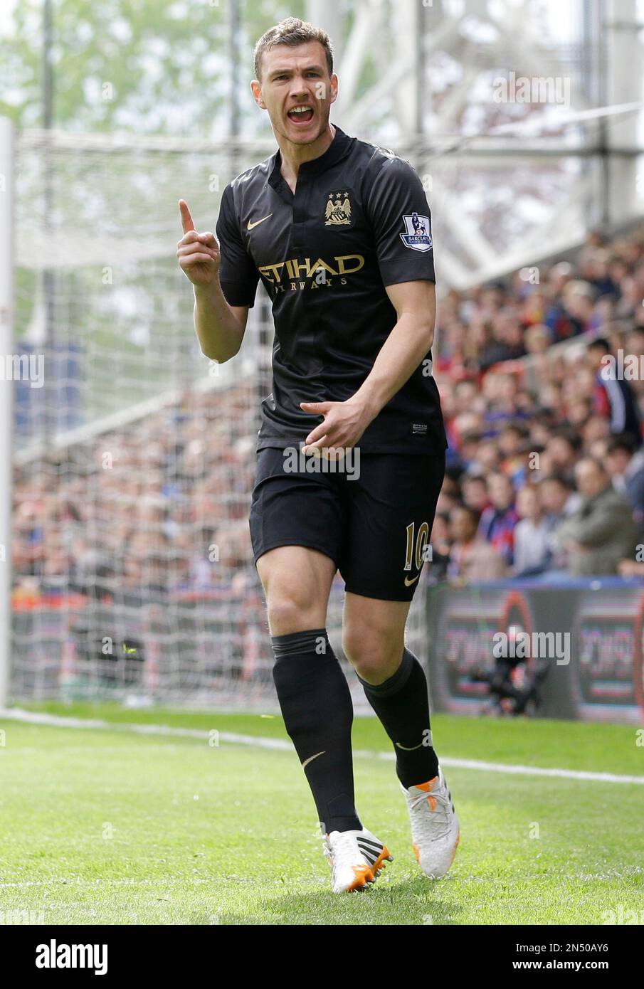 Manchester City's Edin Dzeko celebrates after he scores a goal during ...