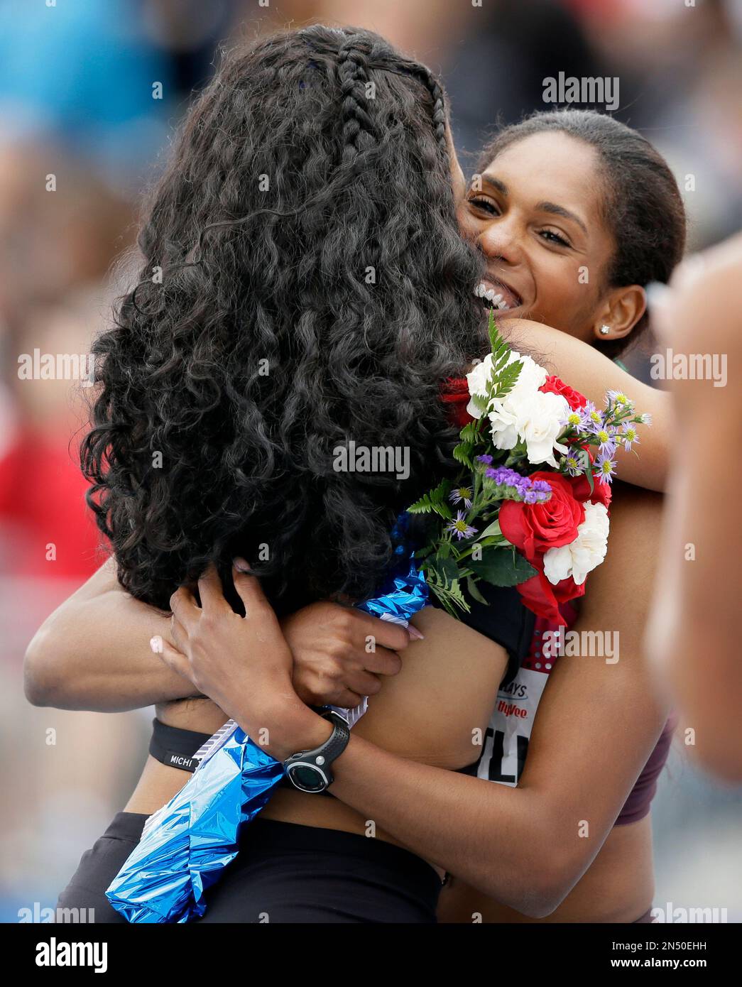 Kristi Castlin, right, gets a hug from Dawn Harper-Nelson after winning ...