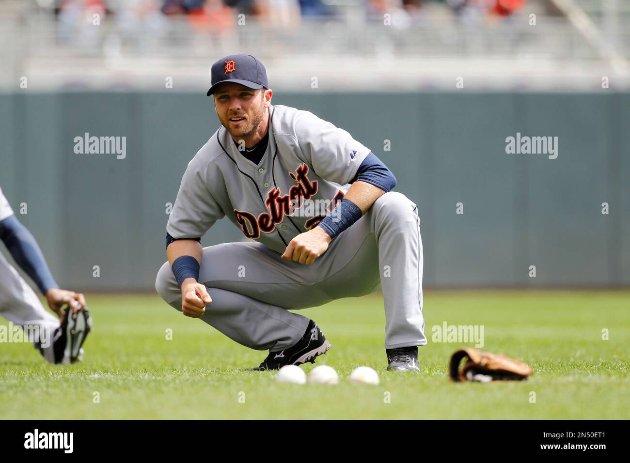 Detroit Tigers shortstop Andrew Romine stretches before a baseball game ...