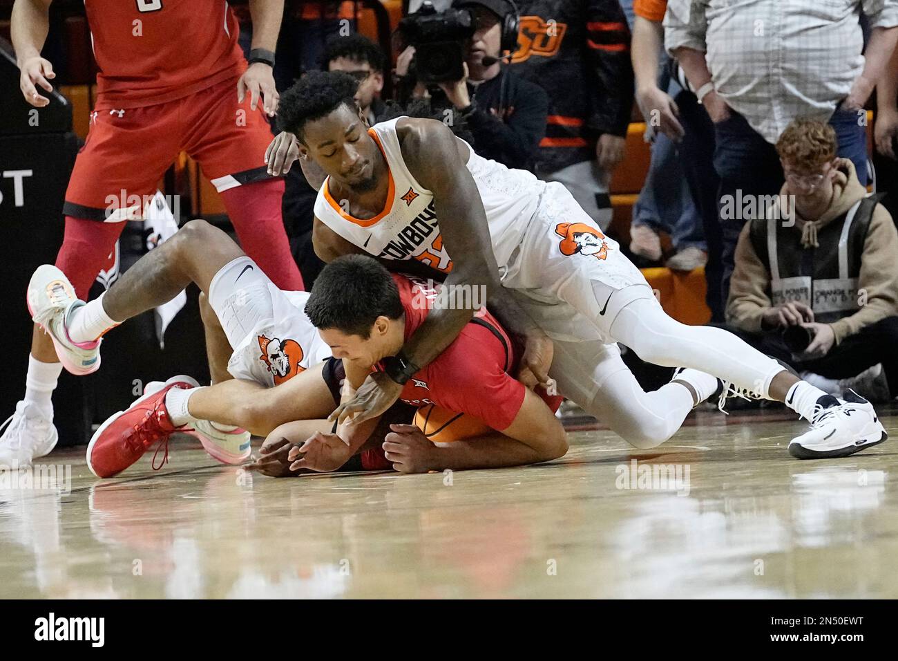 Oklahoma State forward Kalib Boone, right, reaches for the ball held by ...