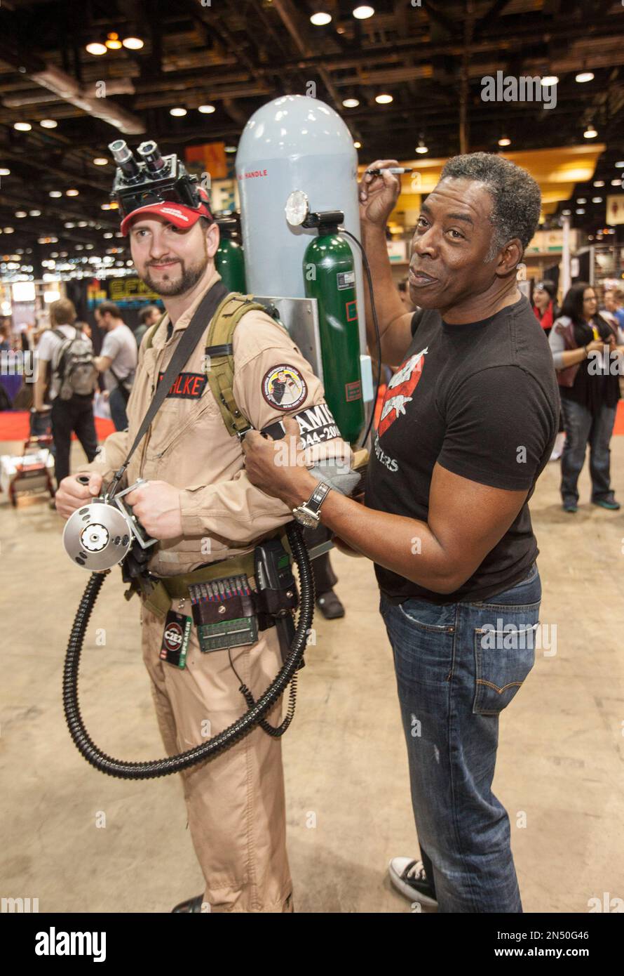 Actor Ernie Hudson signs a fan's Ghostbusters proton pack at the ...
