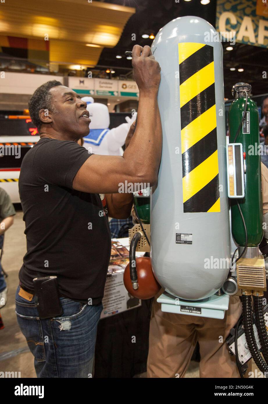 Actor Ernie Hudson signs a fan's Ghostbusters proton pack at the ...