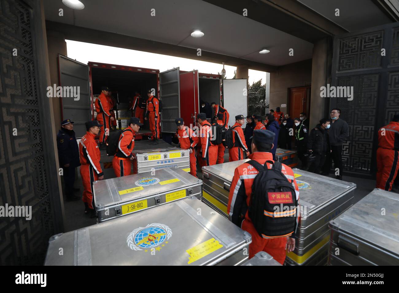 Members of a Chinese rescue team carry equipment and supplies before ...