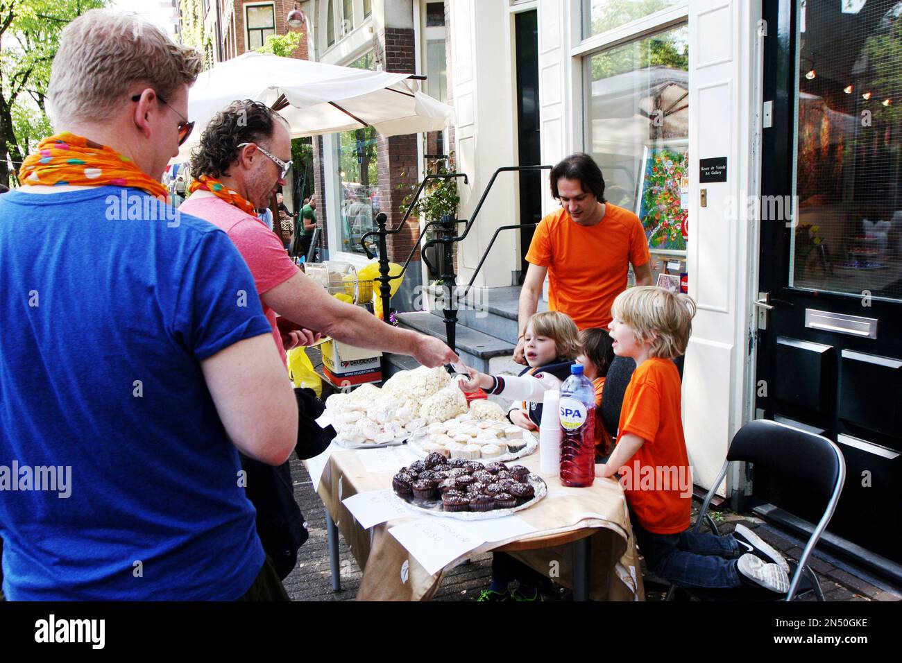 Children sell their homemade food at the annual free market during ...
